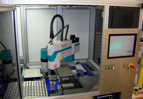 Multifunctional robot packaging cell | Velec Systems Coin